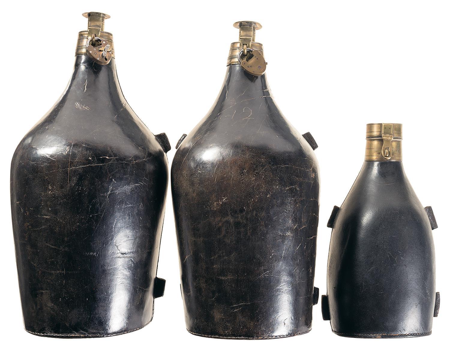 Three Large Leather Powder Flasks | Rock Island Auction