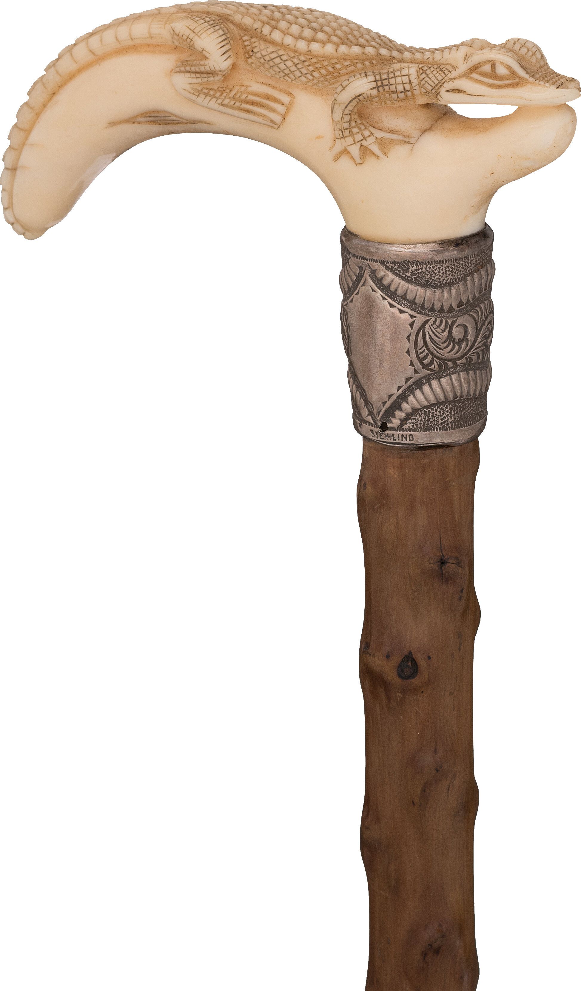 Relief Carved Alligator Cane with Silver Band | Rock Island Auction