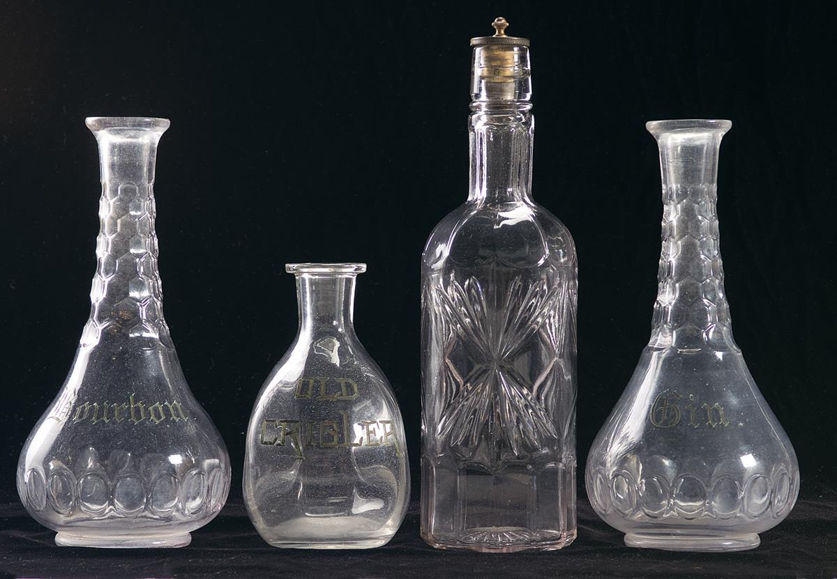 Four Glass Back Bar Bottles | Rock Island Auction