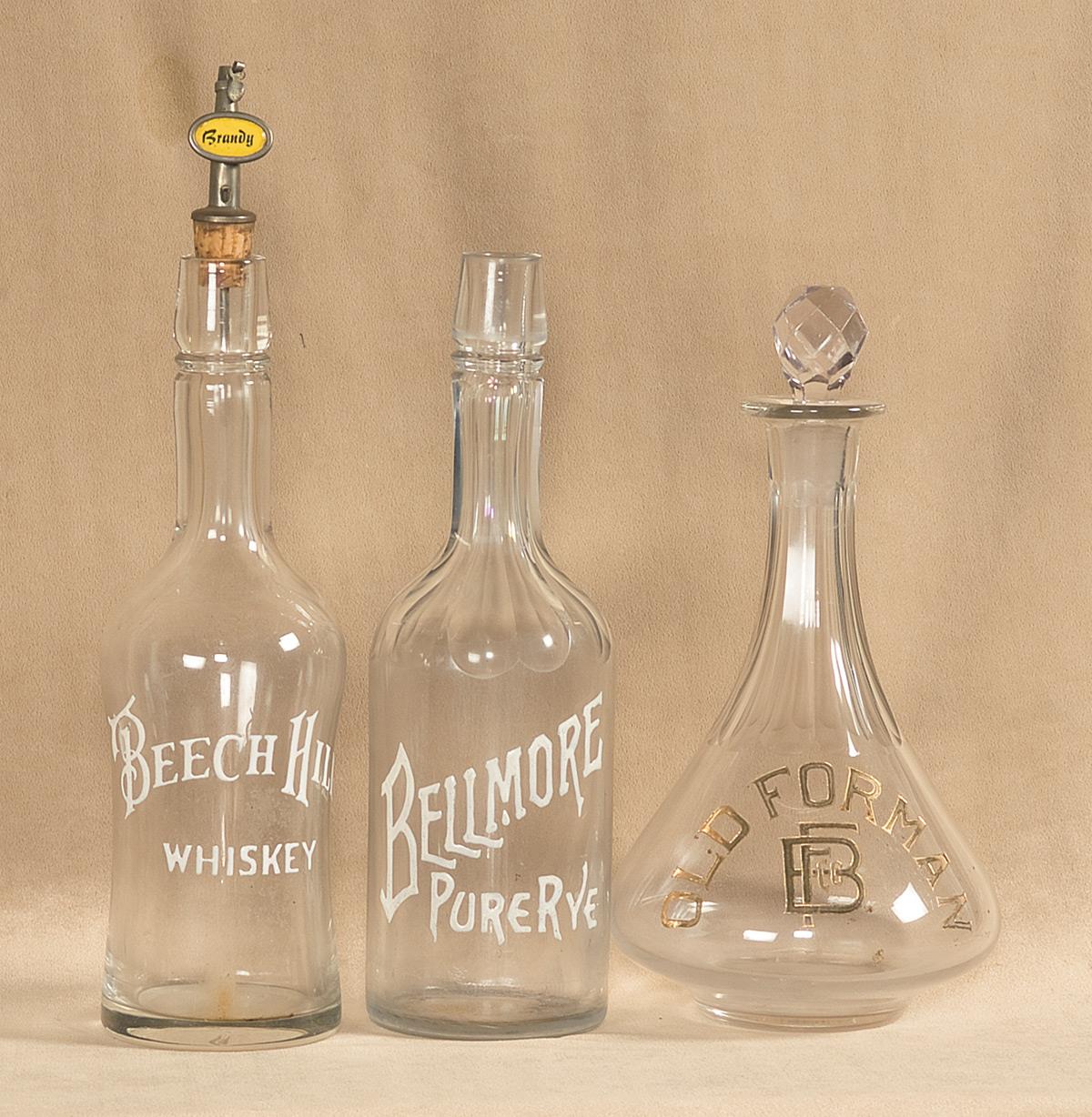 Three Glass Back Bar Bottles | Rock Island Auction