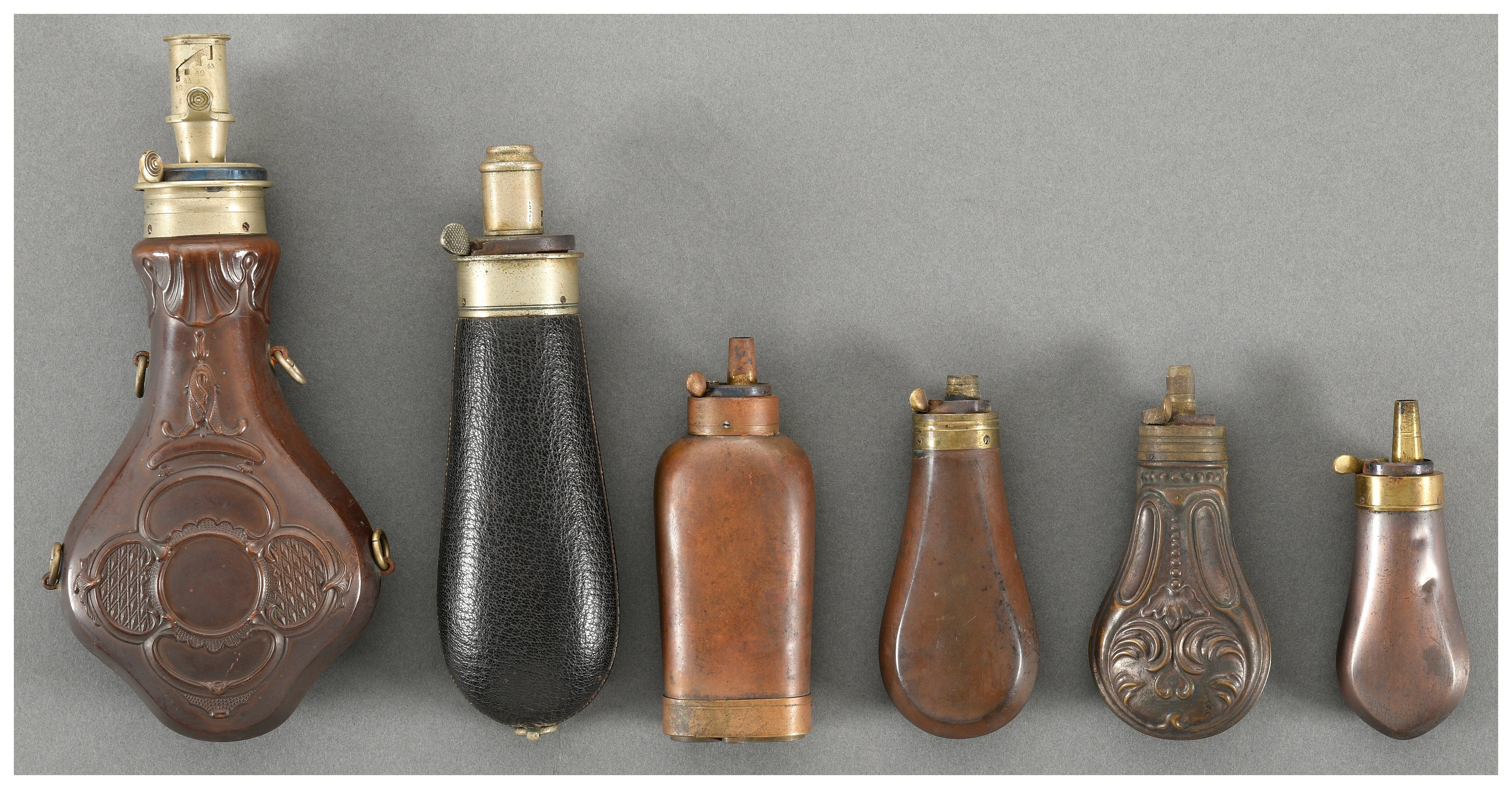 Six Antique Powder Flasks | Rock Island Auction