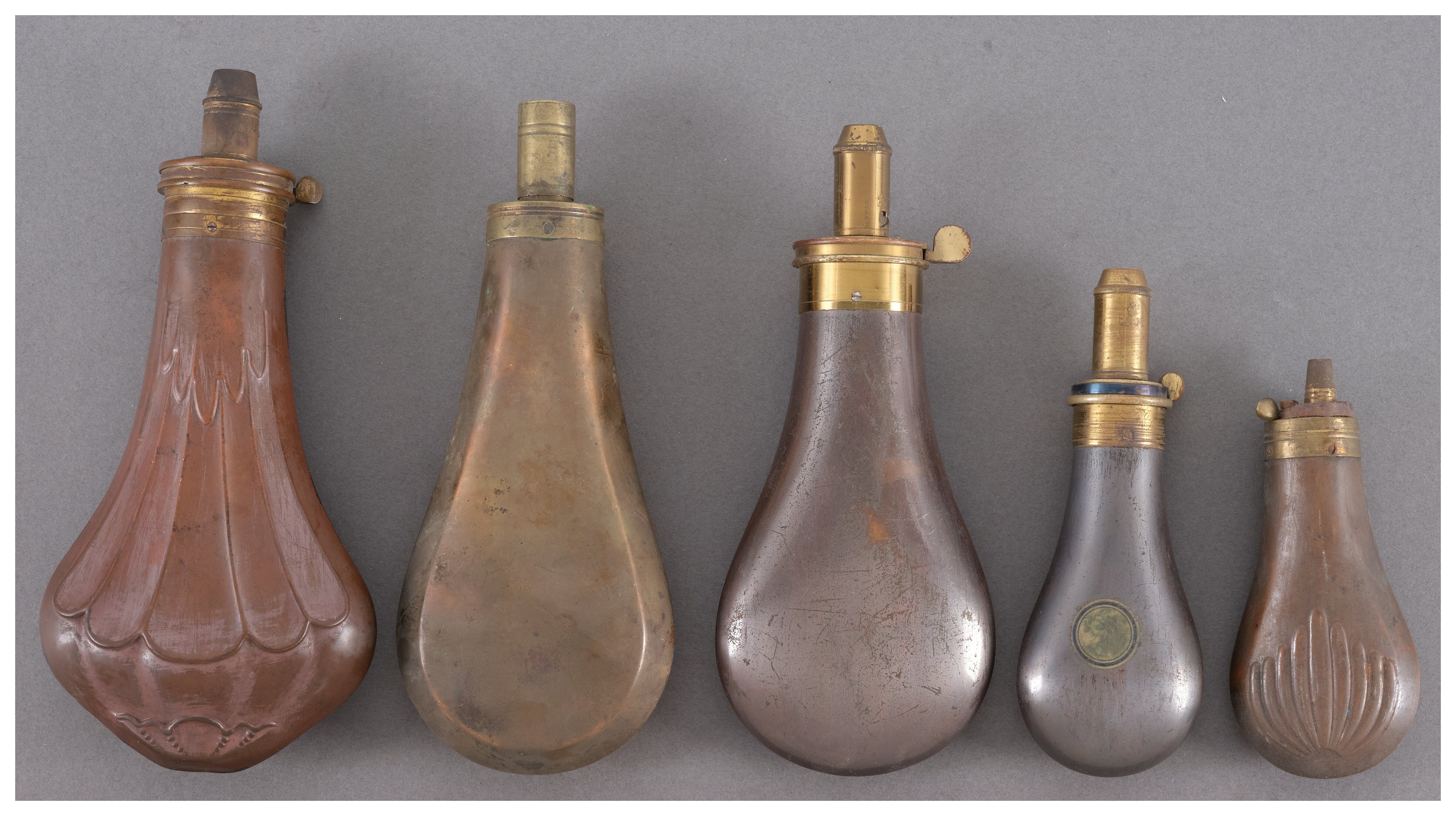 Five Antique Powder Flasks | Rock Island Auction