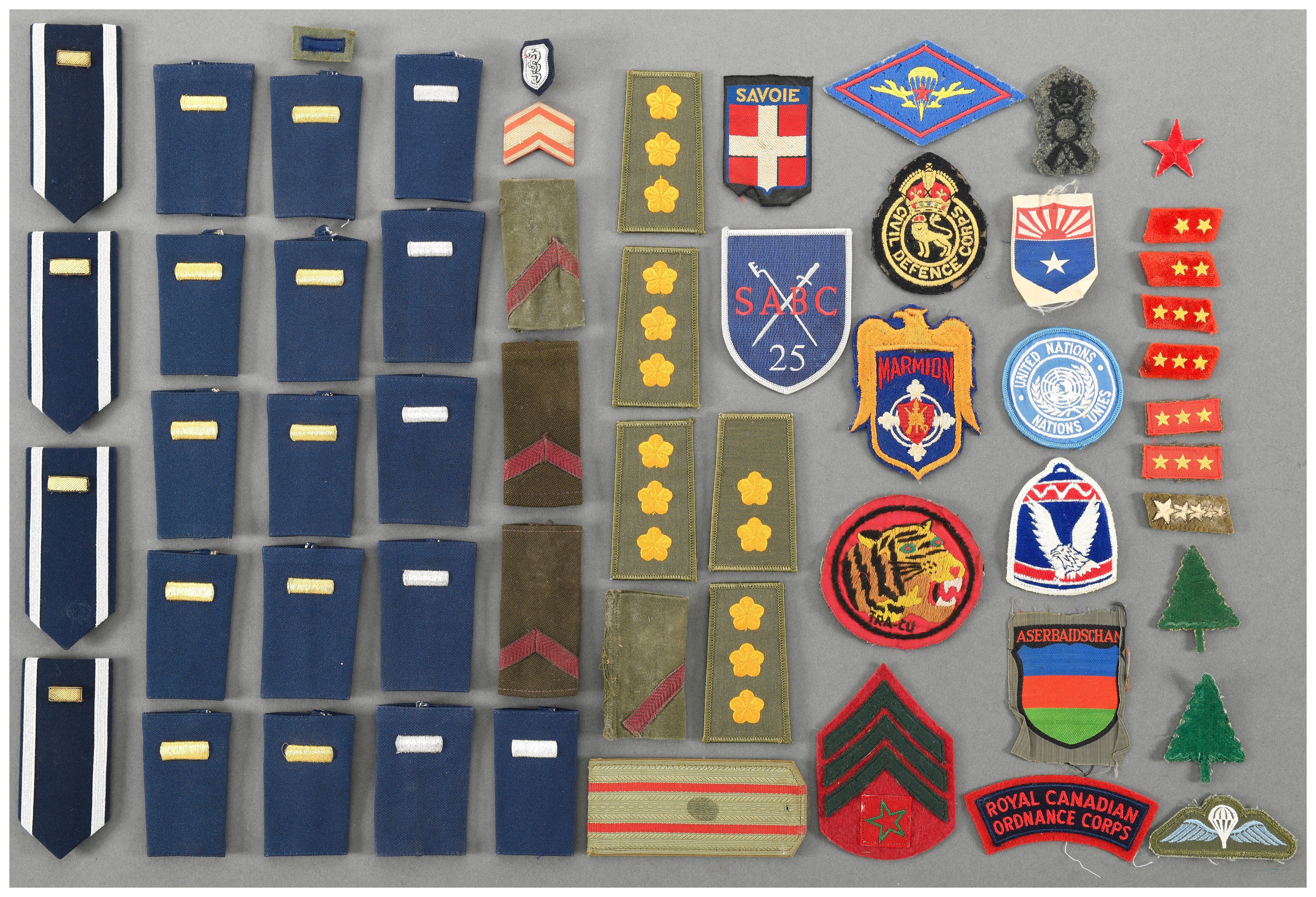 Large Group of Foreign Military Patches and Chevrons | Rock Island Auction
