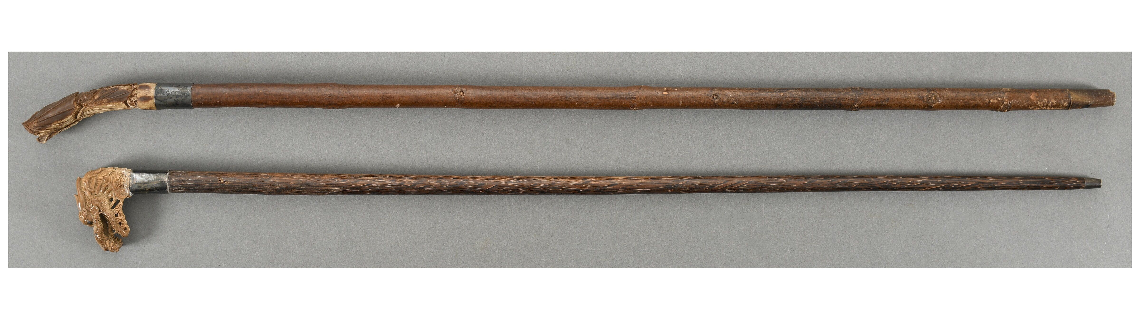 Pair of Canes with Ornately Carved Heads | Rock Island Auction