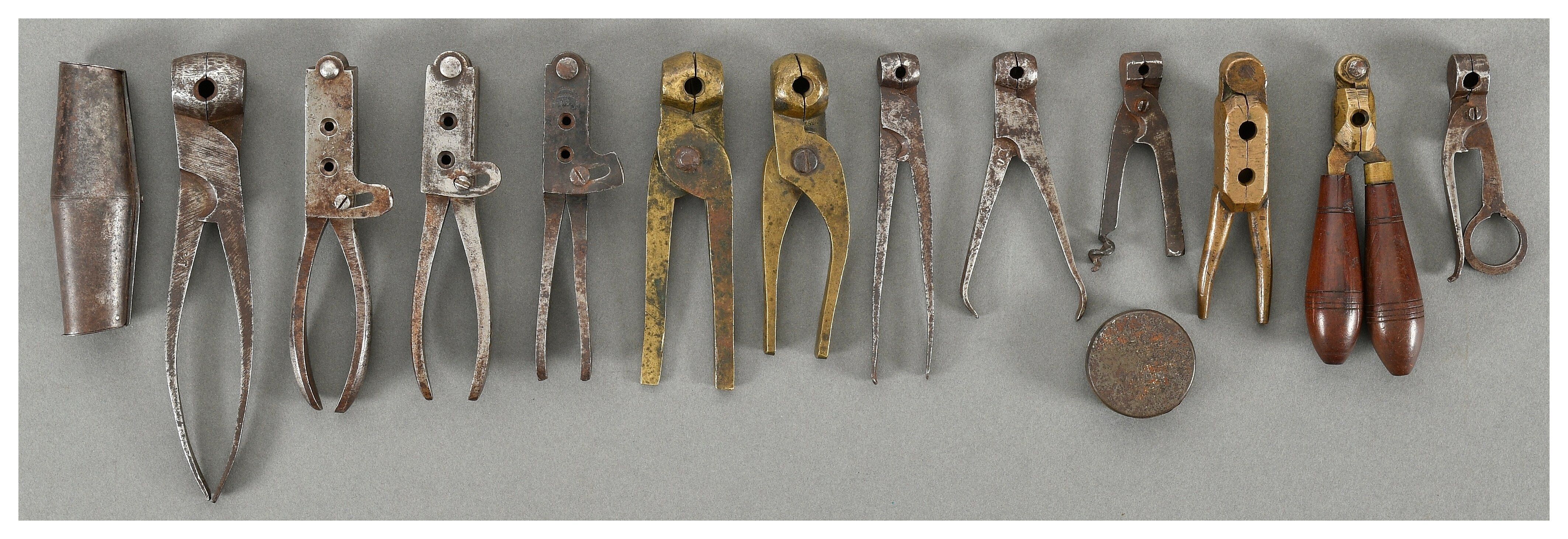 Group of Bullet Molds and Cap Tins | Rock Island Auction