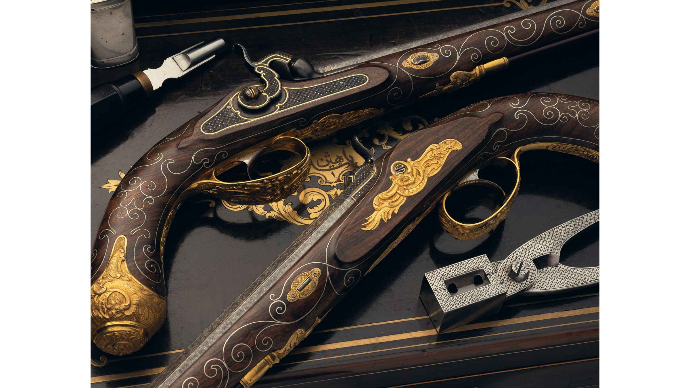 Pair of Engraved and Inlaid Percussion Pistols | Rock Island Auction